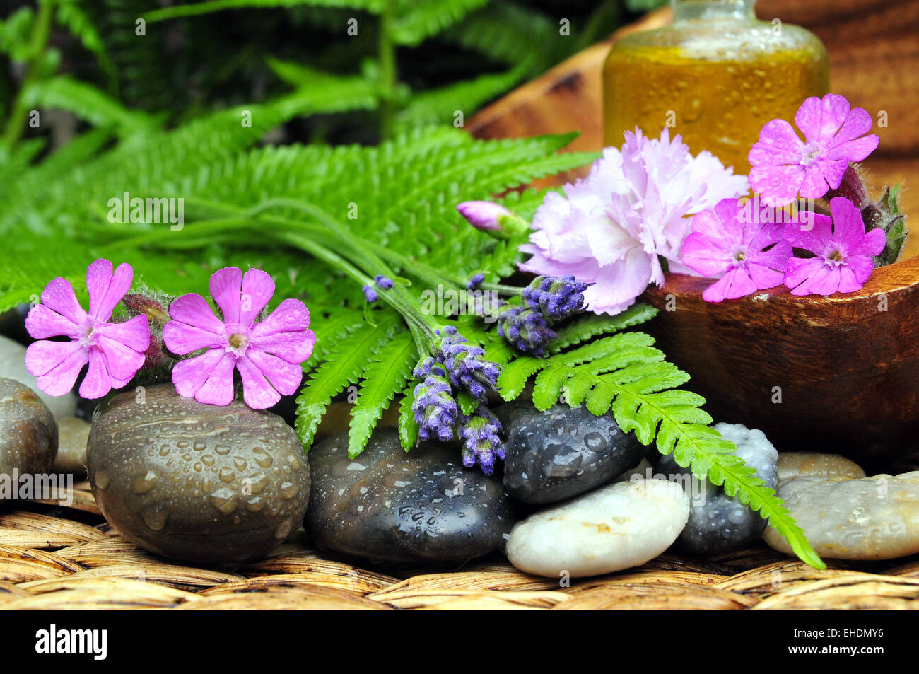 Wellness stones flowers Stock Photo - Alamy