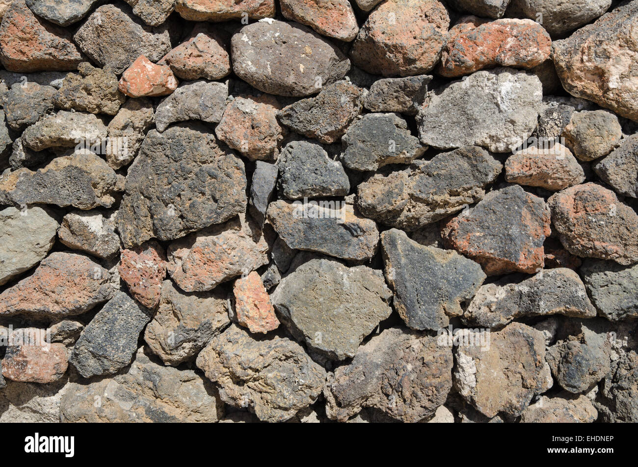 Background image of an old stone wall with natural round stones Stock ...