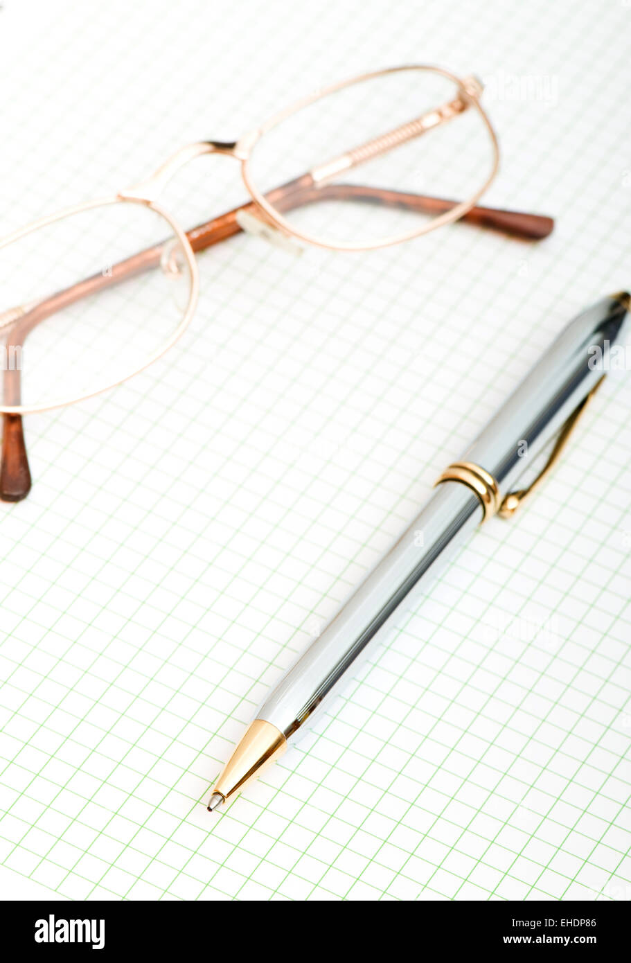 Pen and eye glasses on the page Stock Photo - Alamy