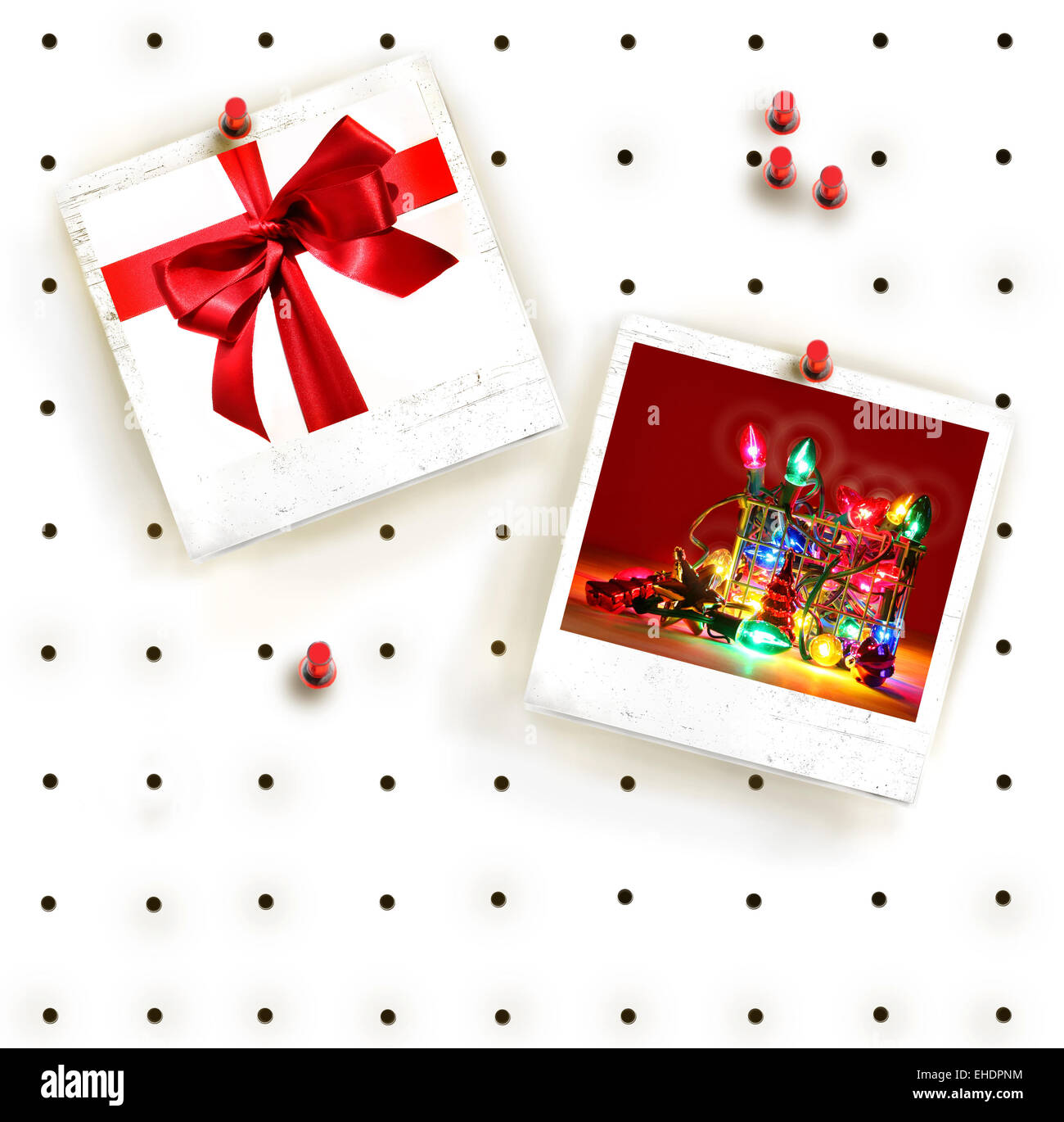 White peg board with photo frames Stock Photo - Alamy