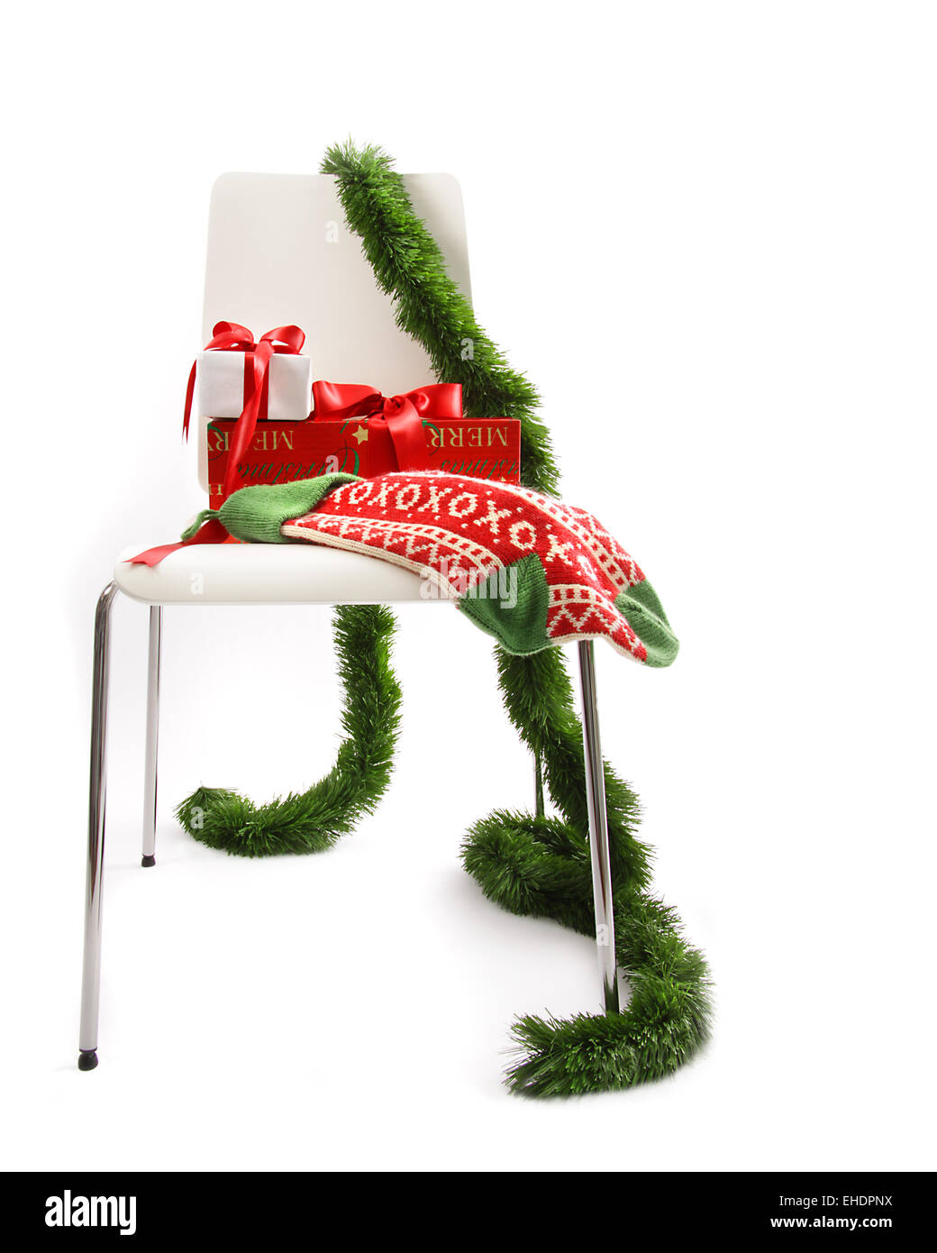 White chair with gifts and garland on white Stock Photo - Alamy