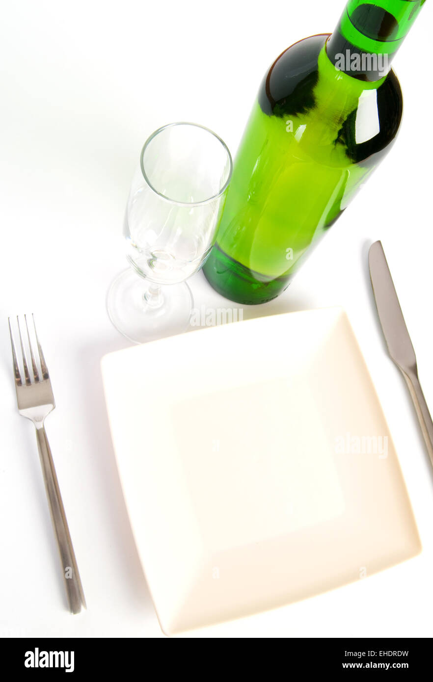 Table setting with bottle of wine Stock Photo - Alamy