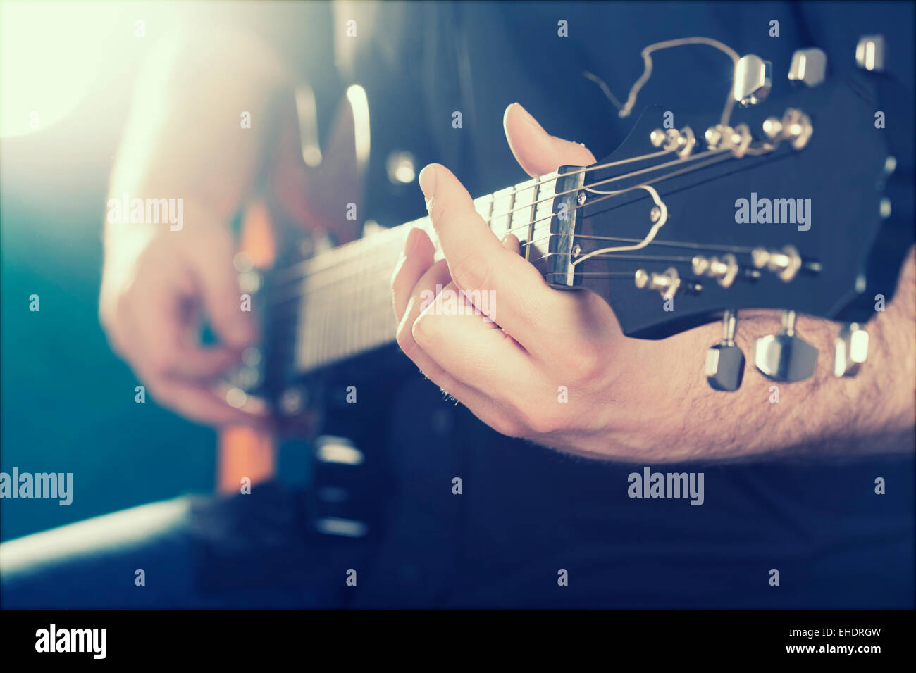 Guitarist on stage in the stagelight Stock Photo - Alamy