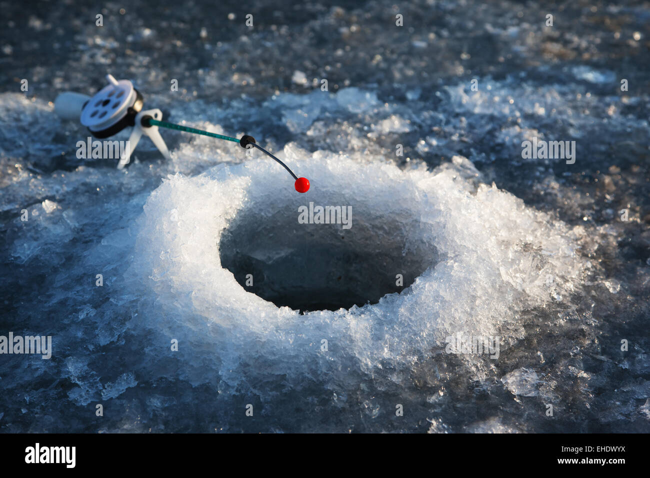 Winter fishing on ice Stock Photo - Alamy