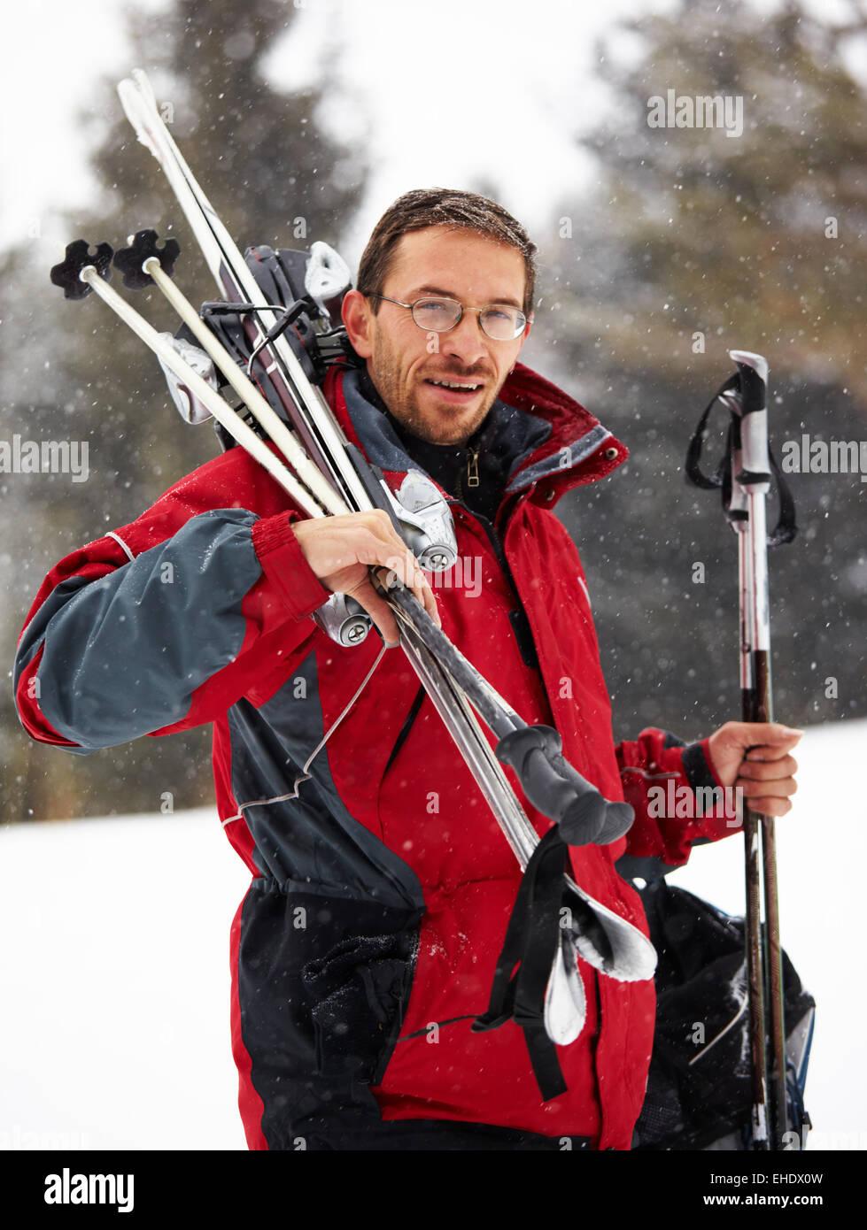 Skier portrait and snowfall Stock Photo - Alamy