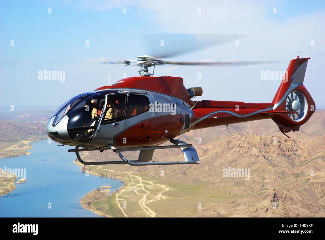 Helicopter on river in desert Stock Photo - Alamy