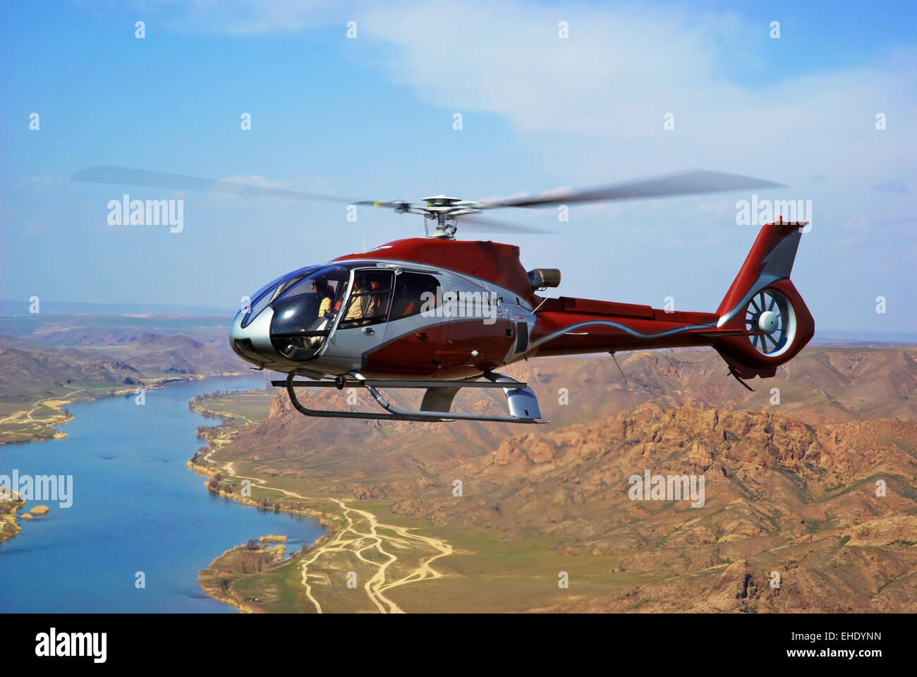 Helicopter on river in desert Stock Photo - Alamy