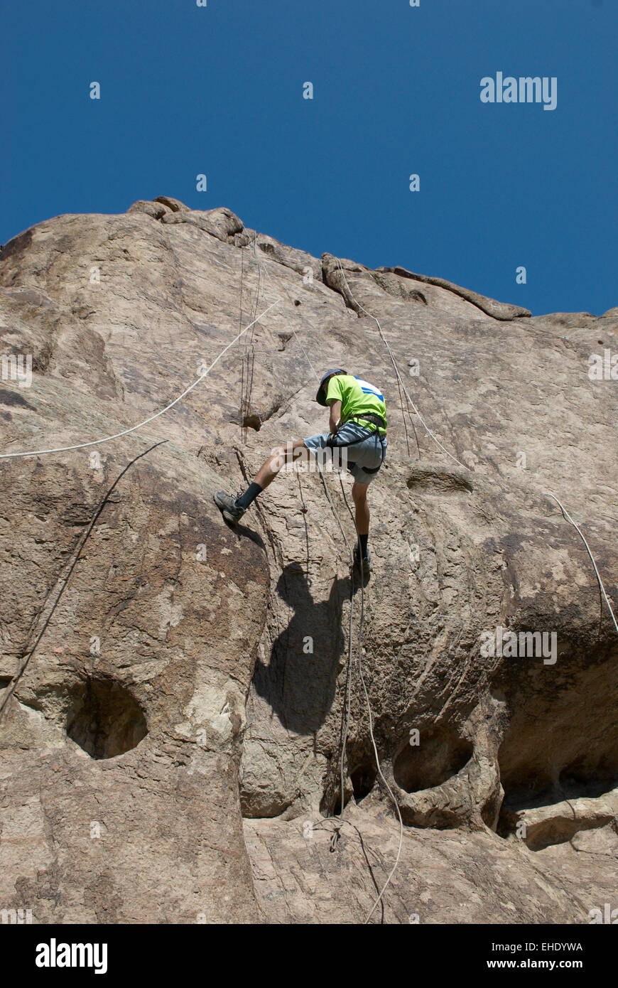 Clamber on cliff Stock Photo - Alamy