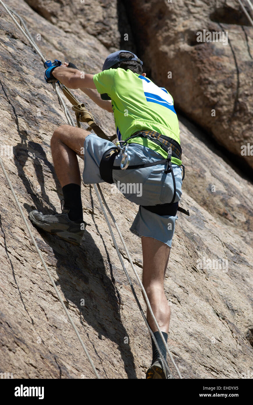 Clamber on cliff Stock Photo - Alamy