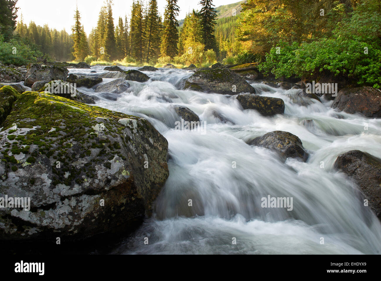 Sunrise and mountain flowing stream Stock Photo - Alamy