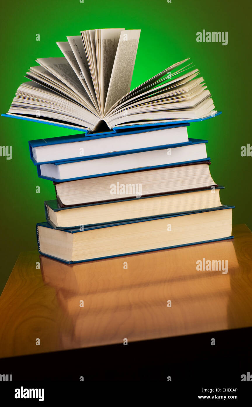 Stack of books against gradient background Stock Photo - Alamy