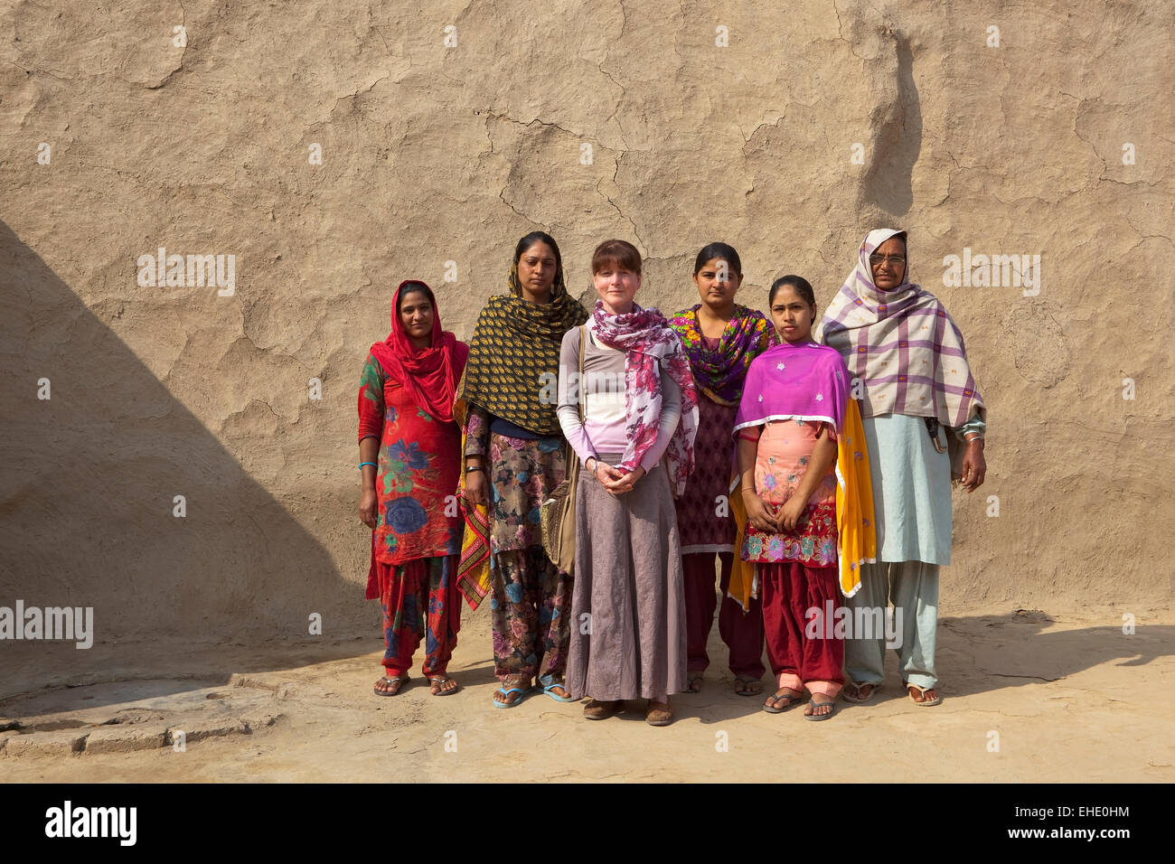 Abohar Punjab India Feb 10 2015. Local women pose with a western lady ...