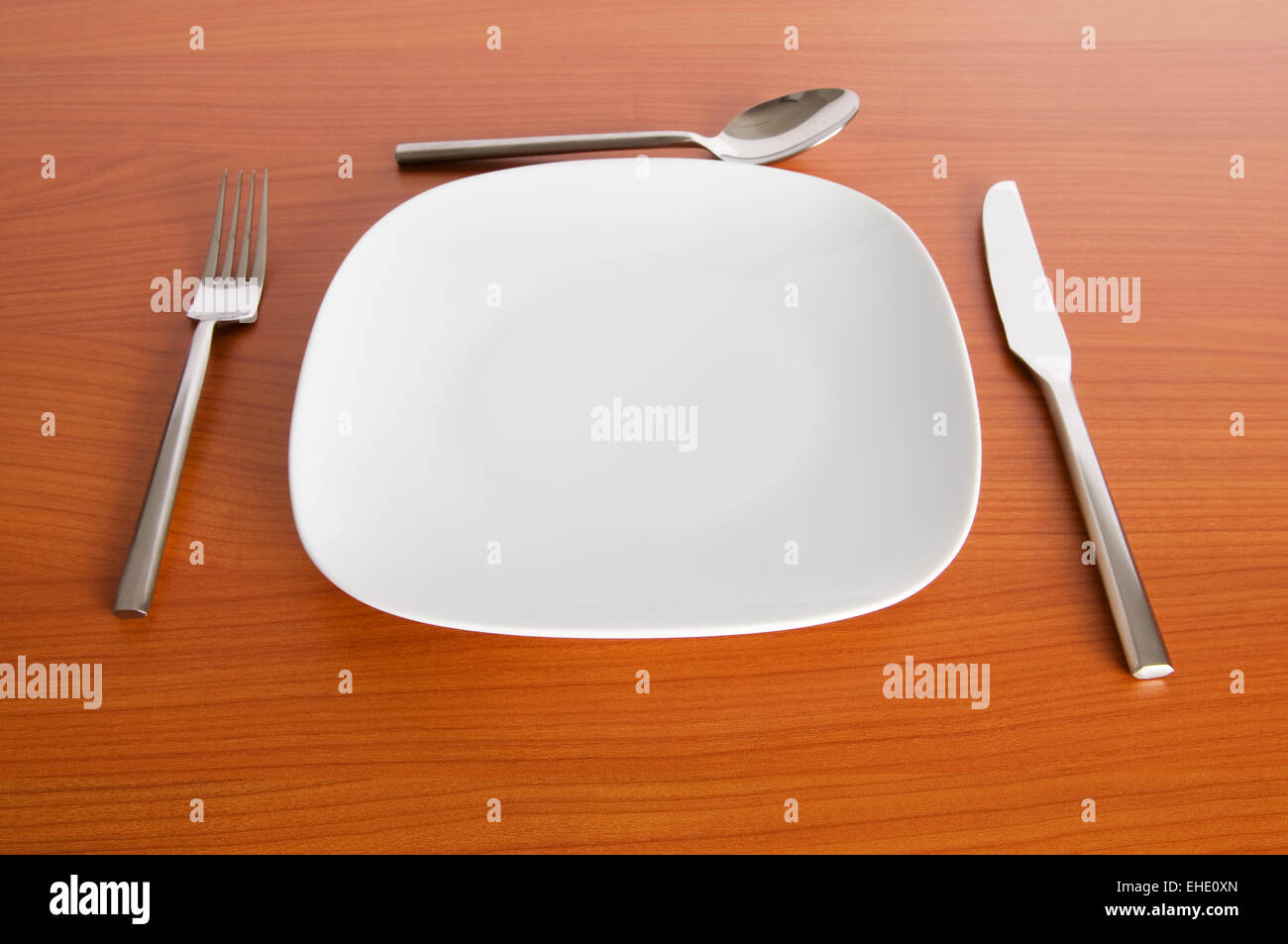 Set of utensils arranged on the table Stock Photo - Alamy