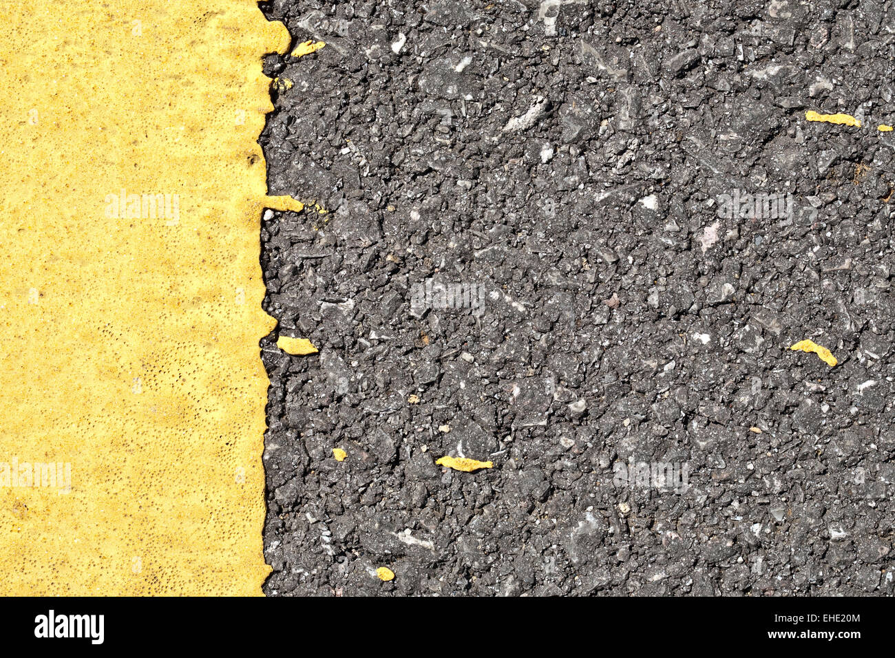 Asphalt texture with yellow border Stock Photo - Alamy