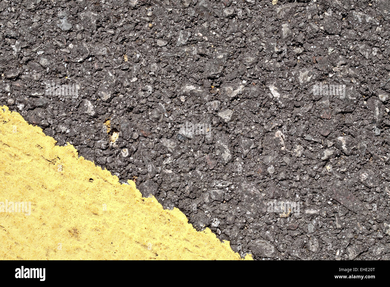 Asphalt texture with yellow corner Stock Photo - Alamy