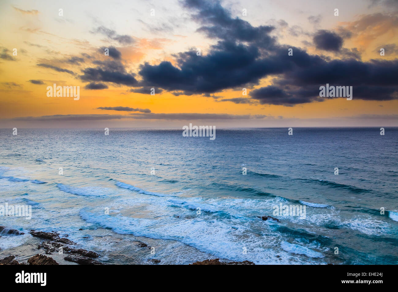 Sunset over Atlantic ocean Stock Photo - Alamy