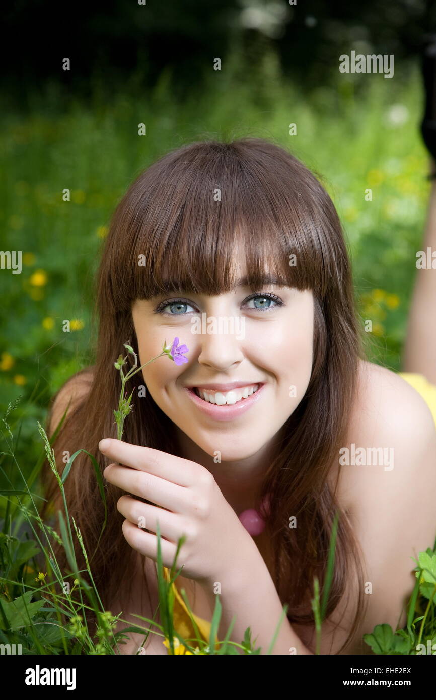 Pretty smiling girl relaxing outdoor Stock Photo - Alamy