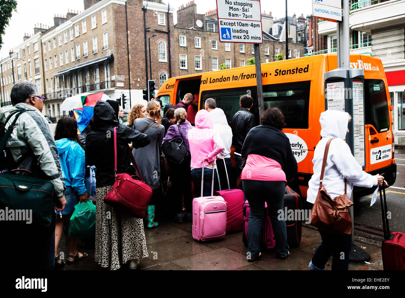 Tourist crowd small Stansted-bound shuttle bus; Gloucester Place ...