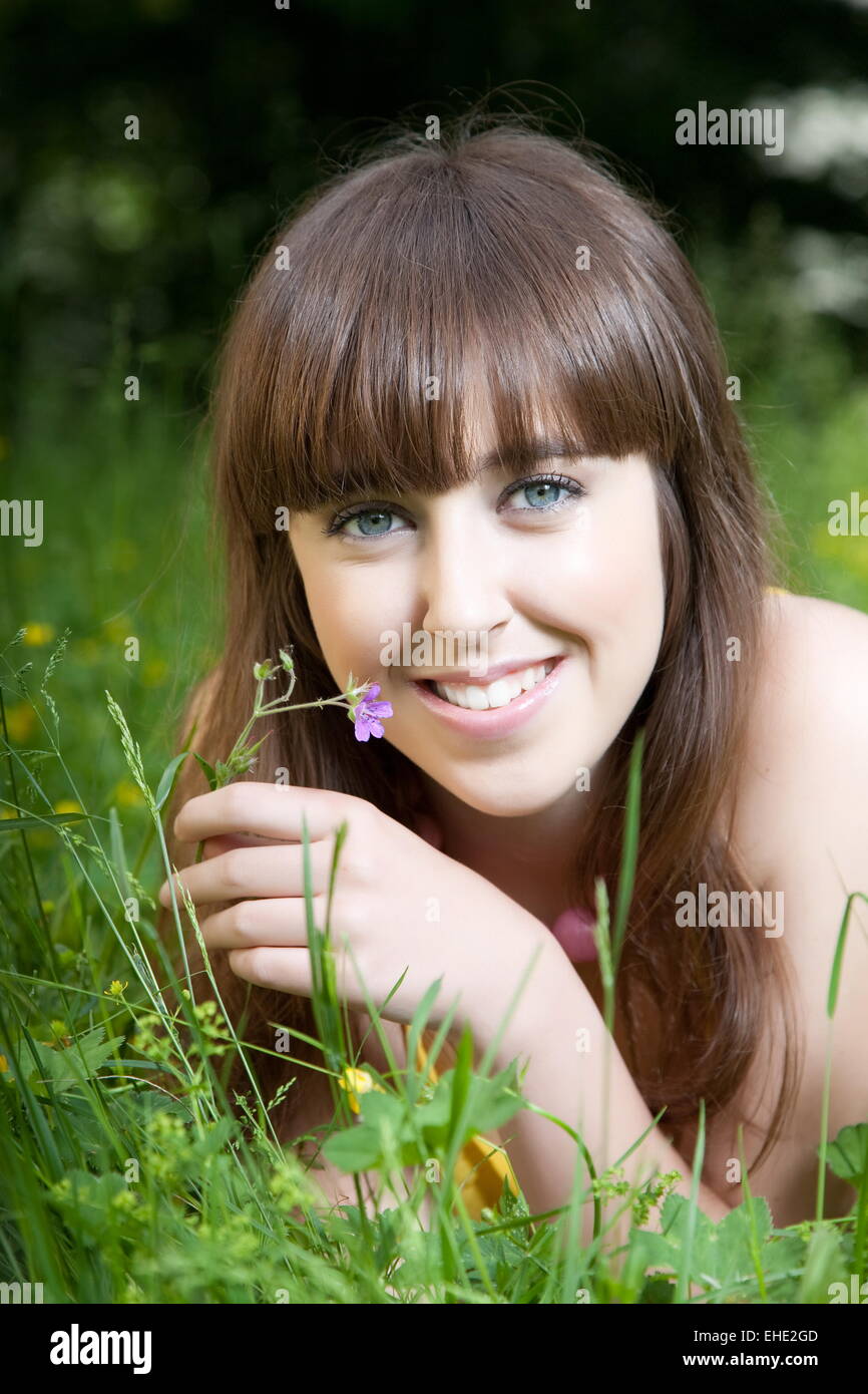 Beautiful woman relaxing at park Stock Photo - Alamy