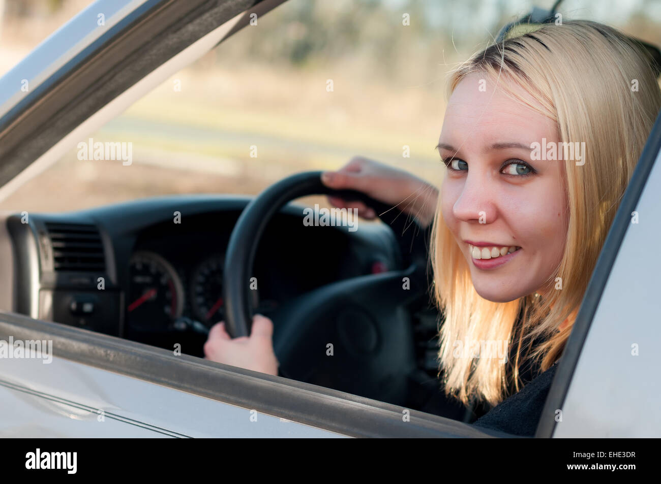Student girl in a car Stock Photo - Alamy