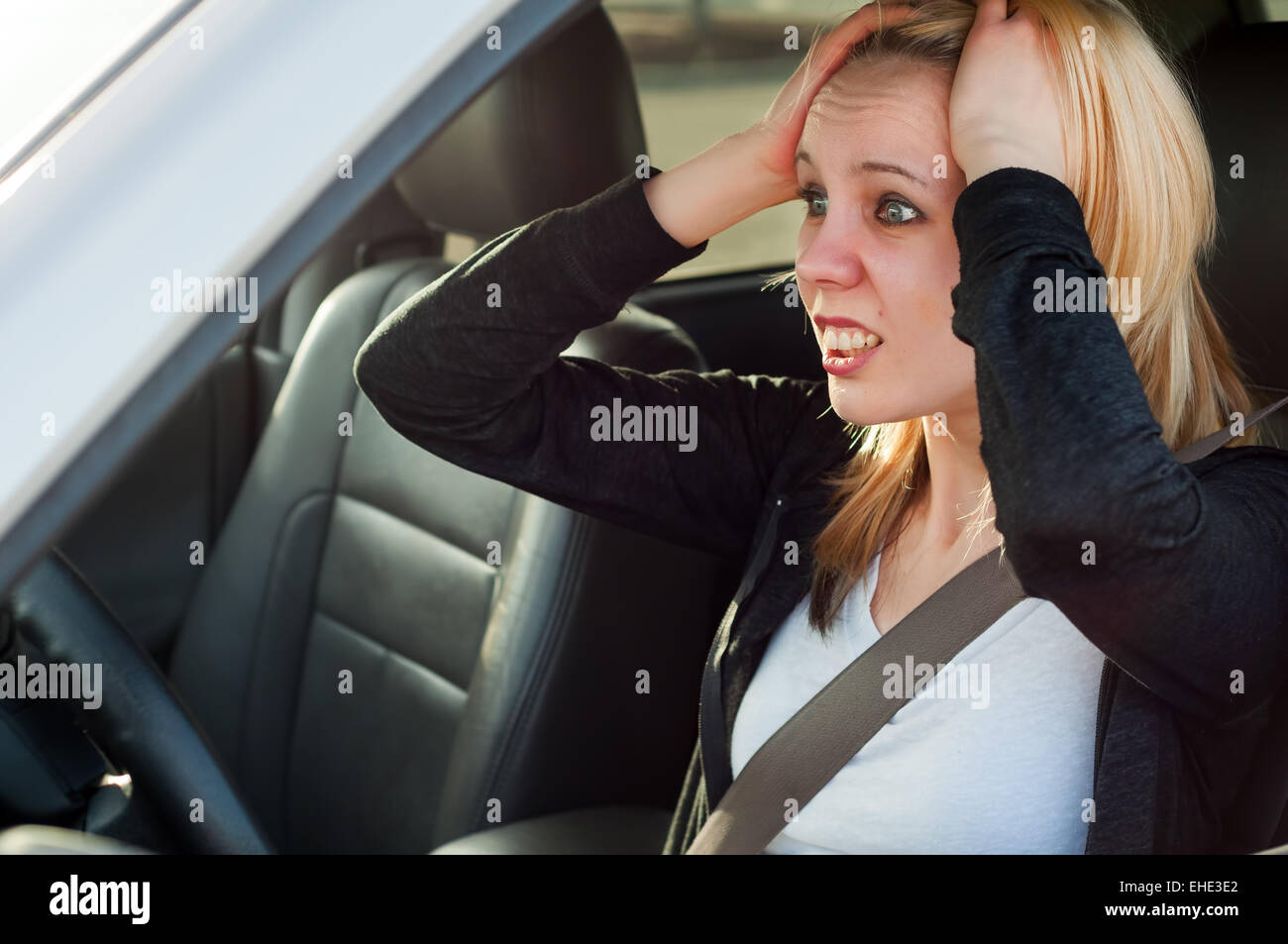 Girl panic in a car Stock Photo - Alamy