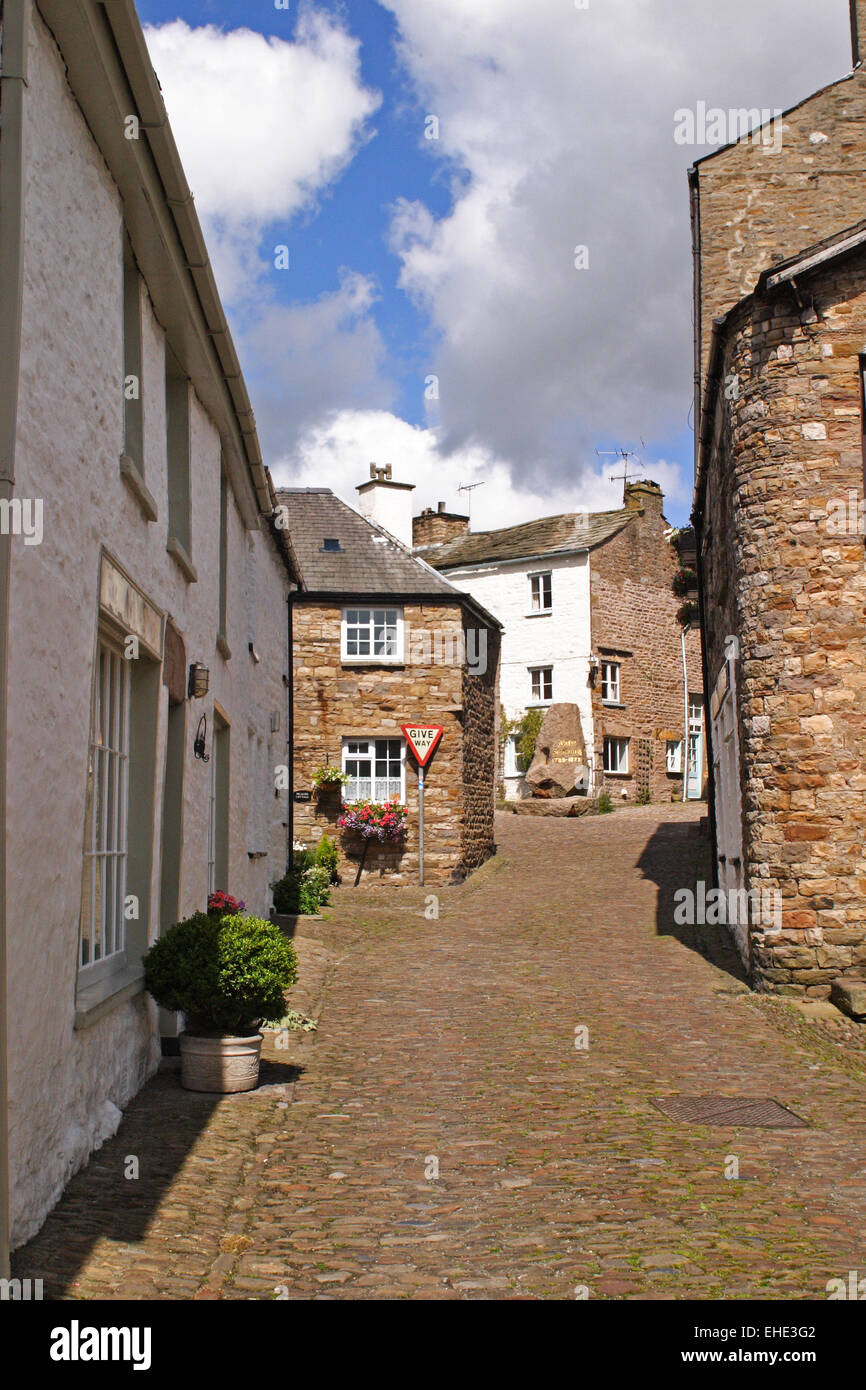 The cobbled streets of the picturesque village of Dent, Cumbria ...