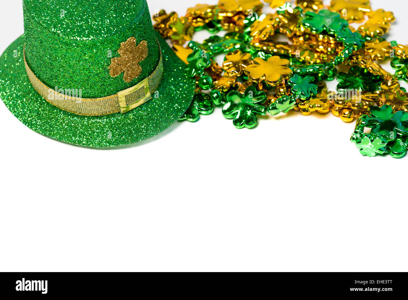 Saint Patrick's day decorations with a hat and beads on a white ...