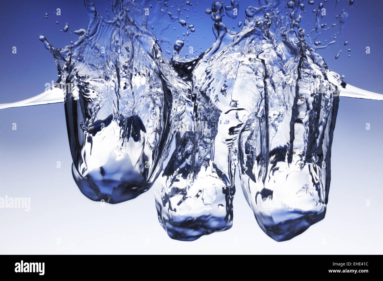 Ice cubes splash Stock Photo - Alamy