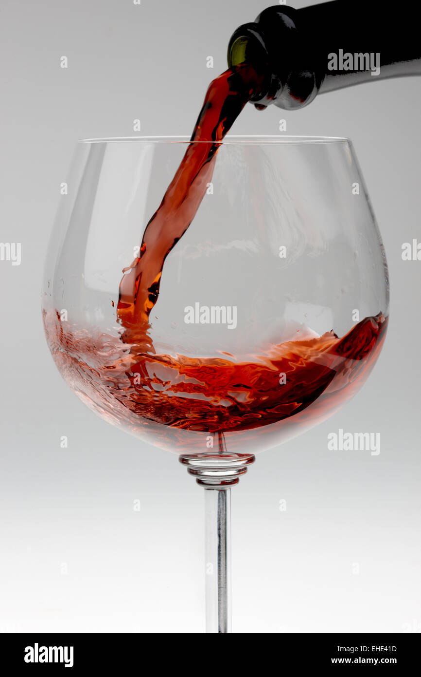 Pouring red wine Stock Photo - Alamy