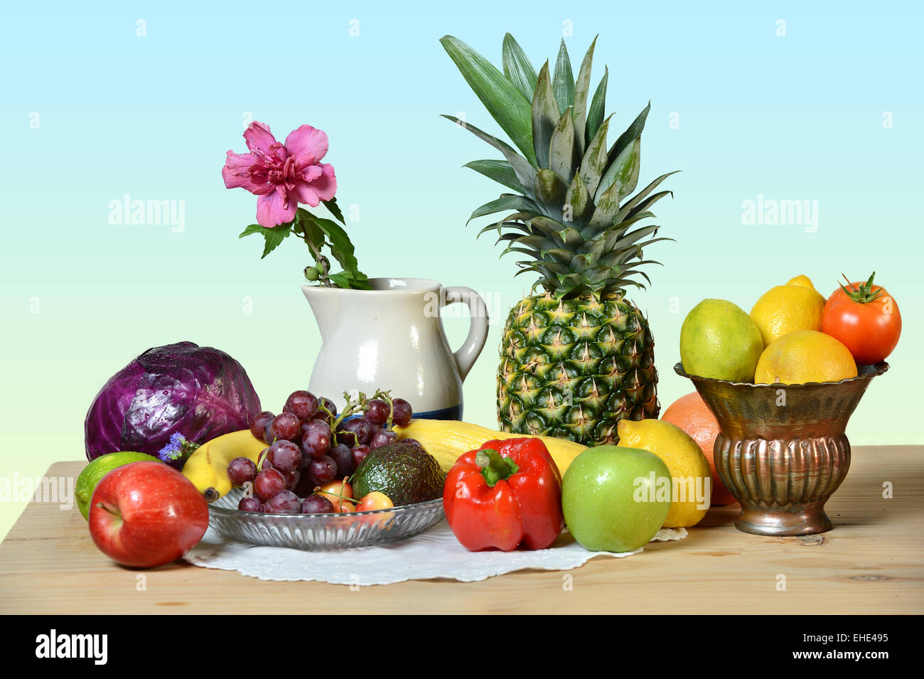 Produce on table isolated over a gradient background Stock Photo - Alamy