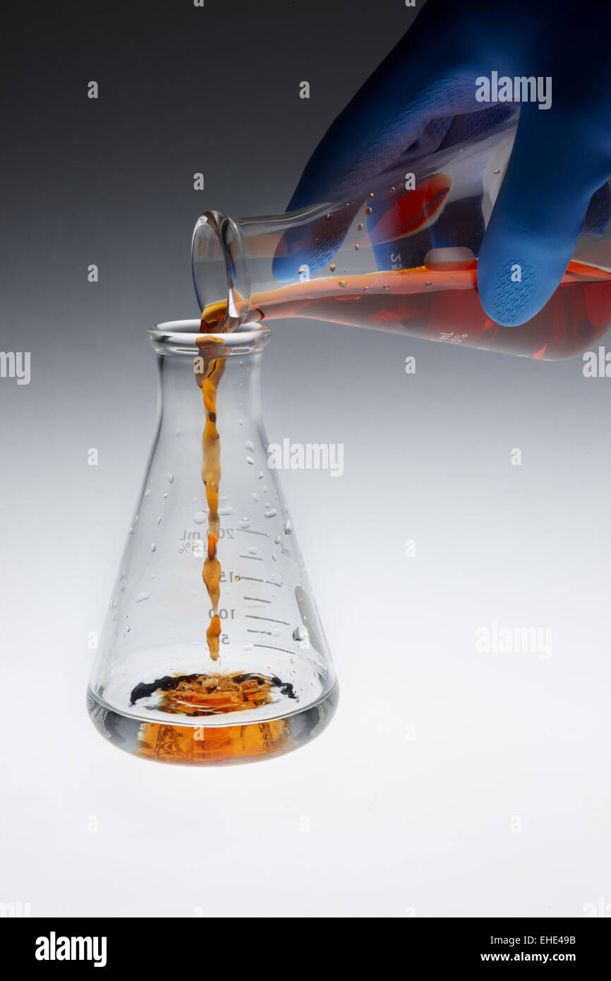 Scientist mixing chemicals hi-res stock photography and images - Alamy