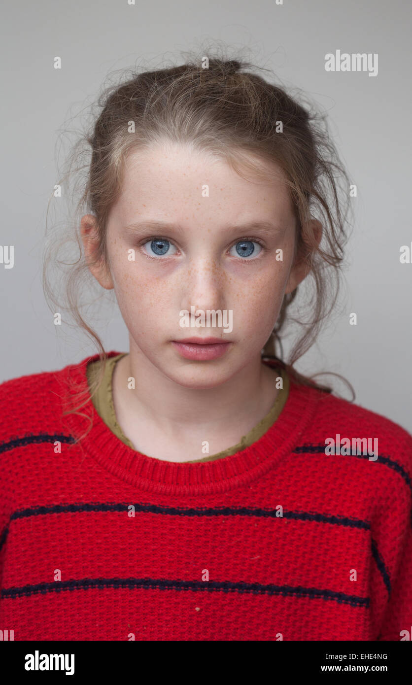 10 year old girl face blue eyes freckles Stock Photo - Alamy