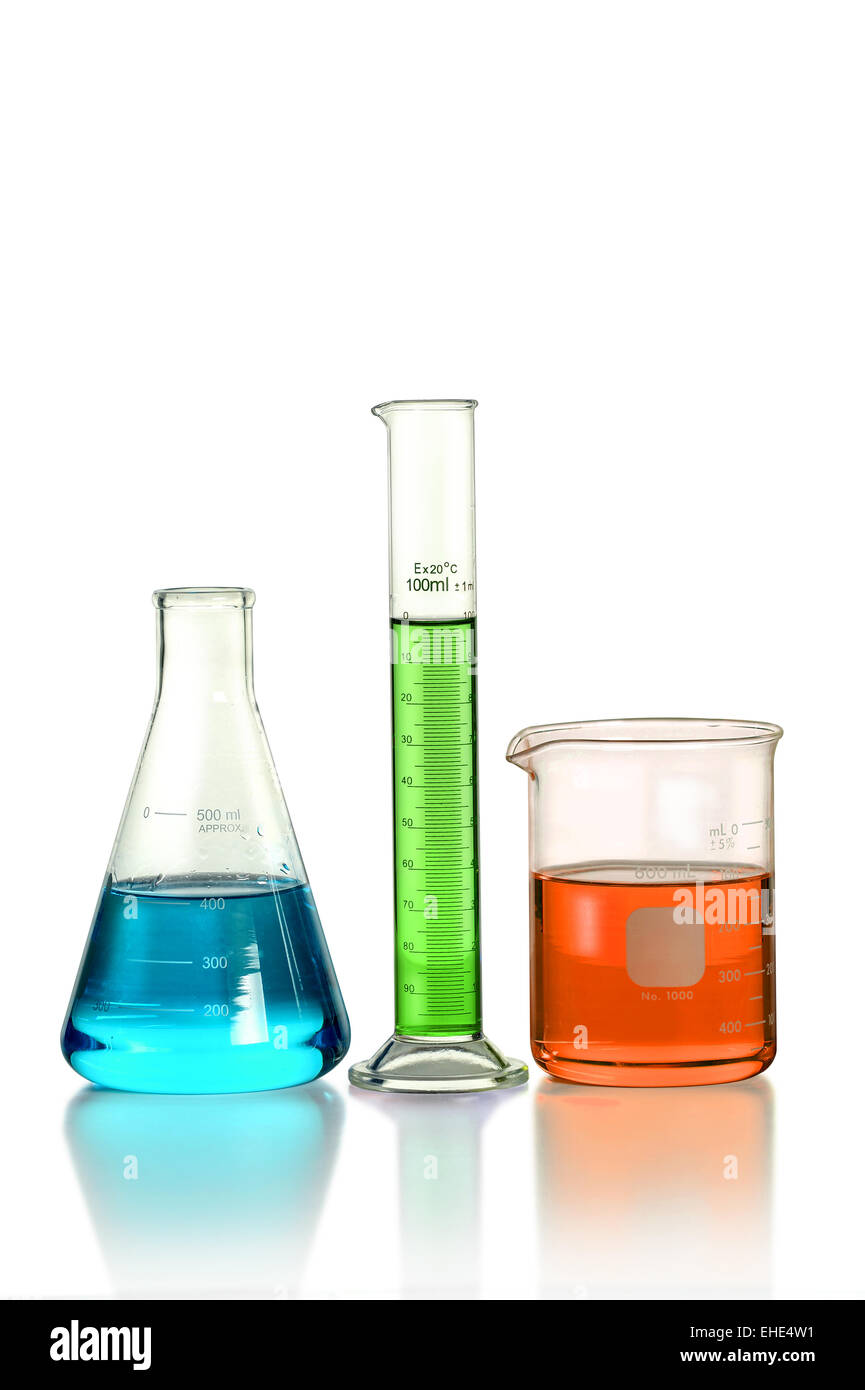 Laboratory glassware on table isolated over white background - With ...