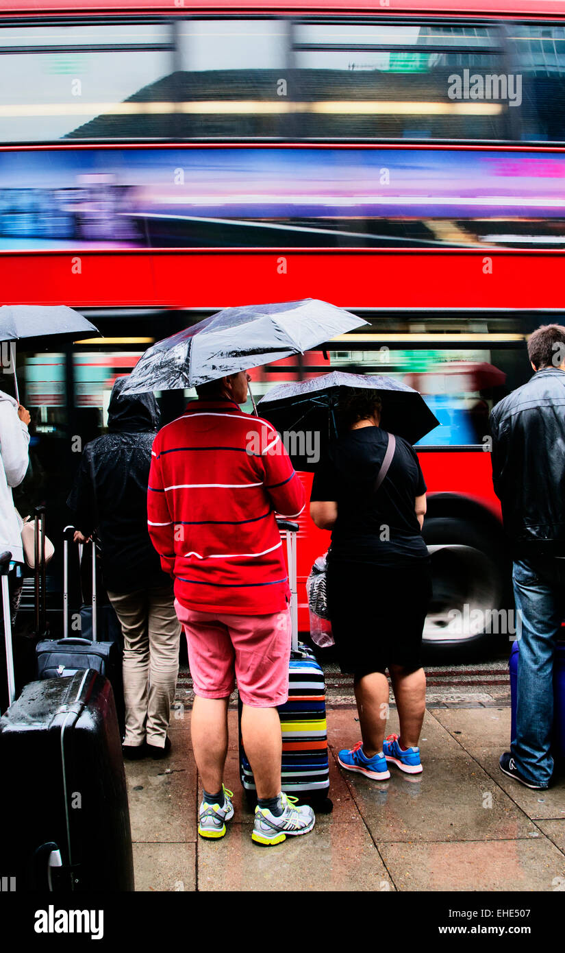 Waiting for bus in the rain hi-res stock photography and images - Alamy