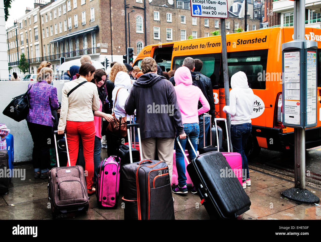 Tourist crowd small Stansted-bound shuttle bus; Gloucester Place ...