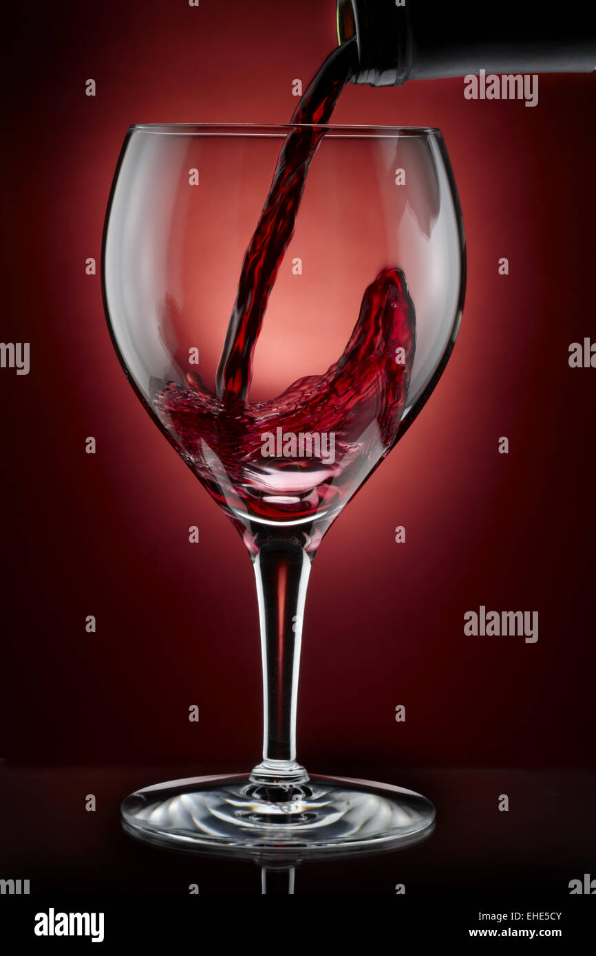 Pouring red wine Stock Photo - Alamy