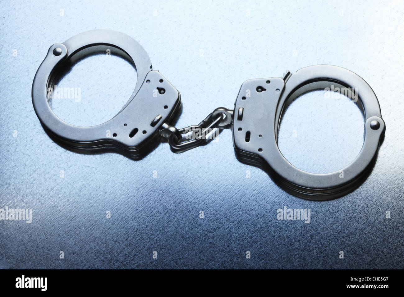 Locked handcuffs hi-res stock photography and images - Alamy