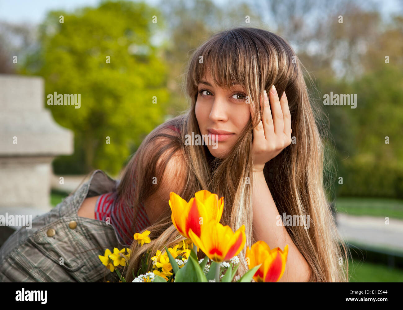 beautiful spring portrait with tulips Stock Photo - Alamy