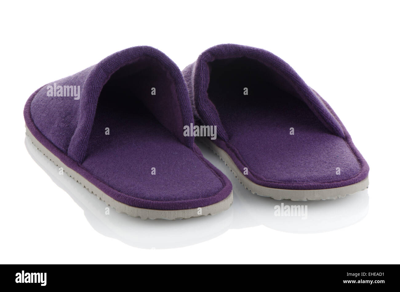 A pair of purple slippers on a white background Stock Photo - Alamy