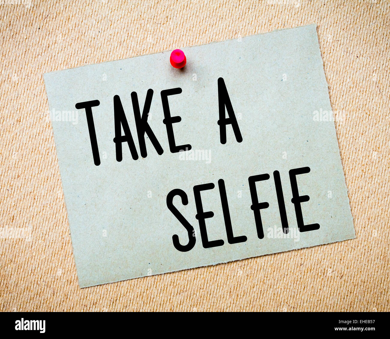 Recycled paper note pinned on cork board. Take a Selfie Message ...