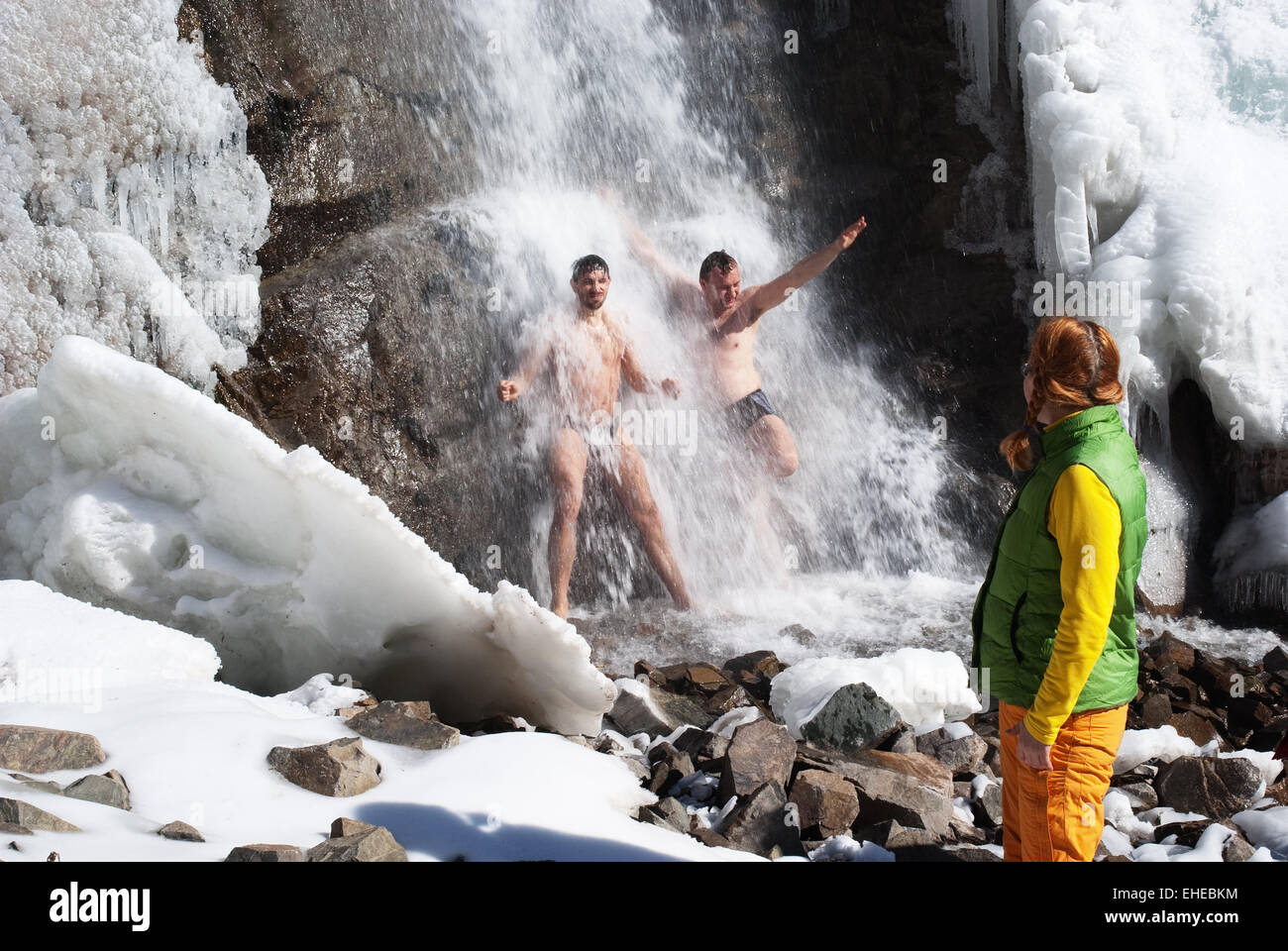 Swimming in winter waterfall Stock Photo - Alamy