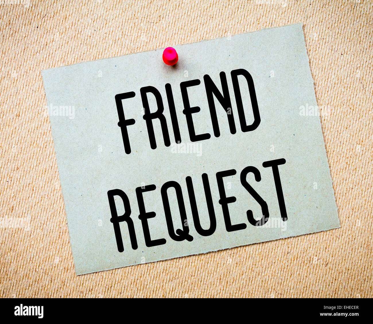 Recycled paper note pinned on cork board. Friend Request Message ...