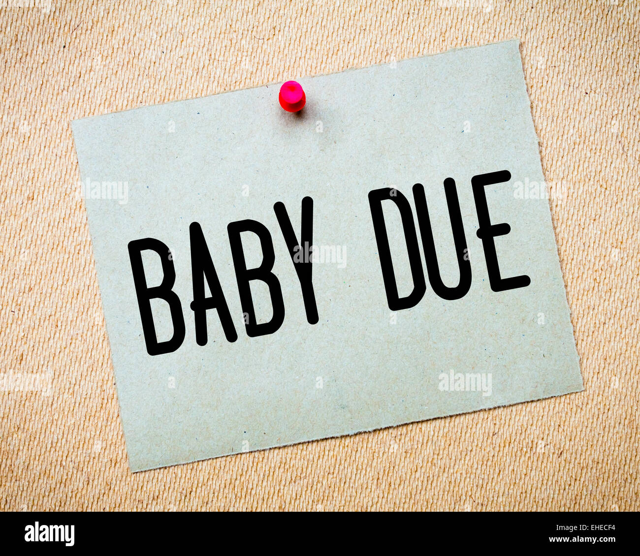 Recycled paper note pinned on cork board. Baby Due Message. Concept ...