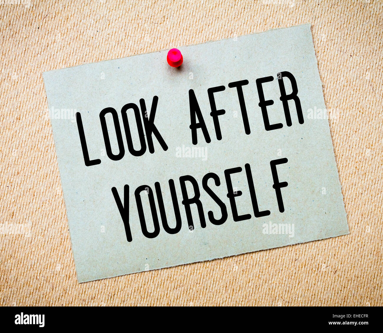 Recycled paper note pinned on cork board. Look After Yourself Message ...