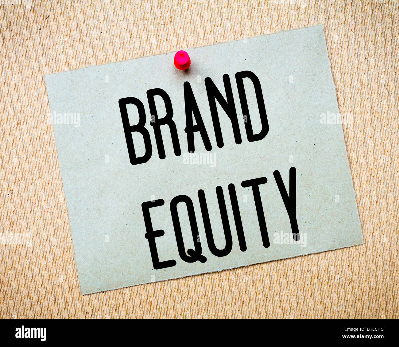 Recycled paper note pinned on cork board. Brand Equity Message. Concept ...
