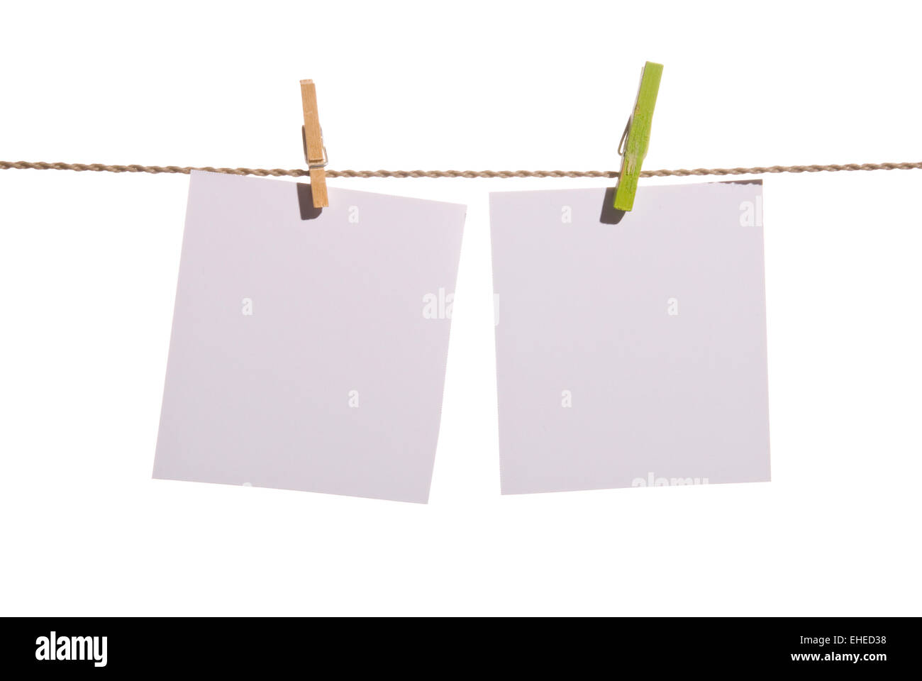 Two clear photos on a rope Stock Photo - Alamy