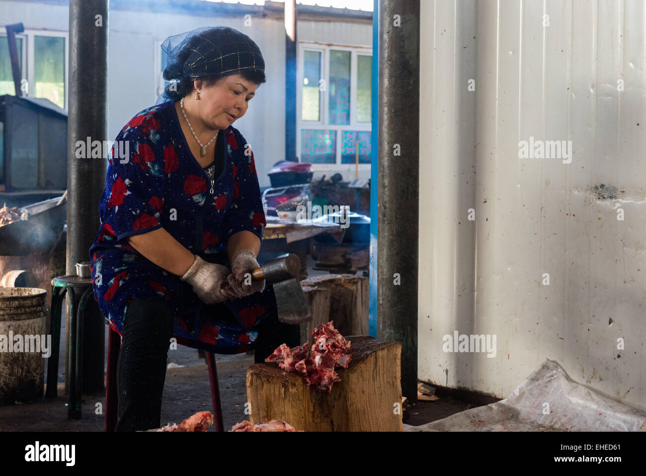 Lady Butcher Cutting Meat, Yining, Bazaar Stock Photo - Alamy