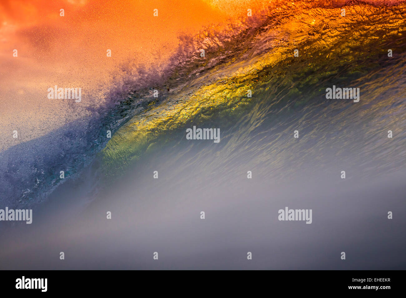 Colored Ocean Wave Falling Down at Sunset Time Stock Photo - Alamy