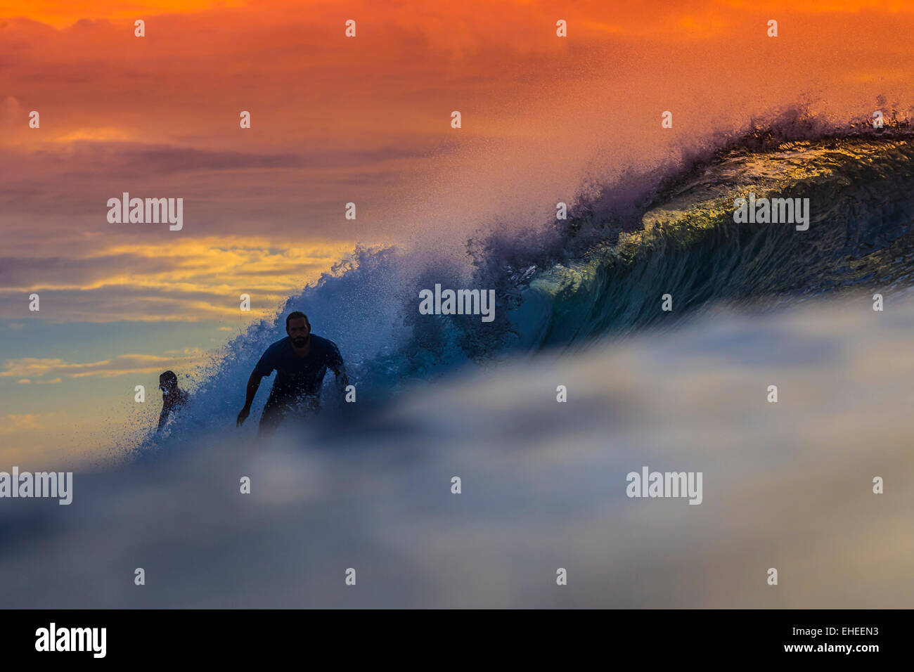Colored Ocean Wave Falling Down at Sunset Time Stock Photo - Alamy