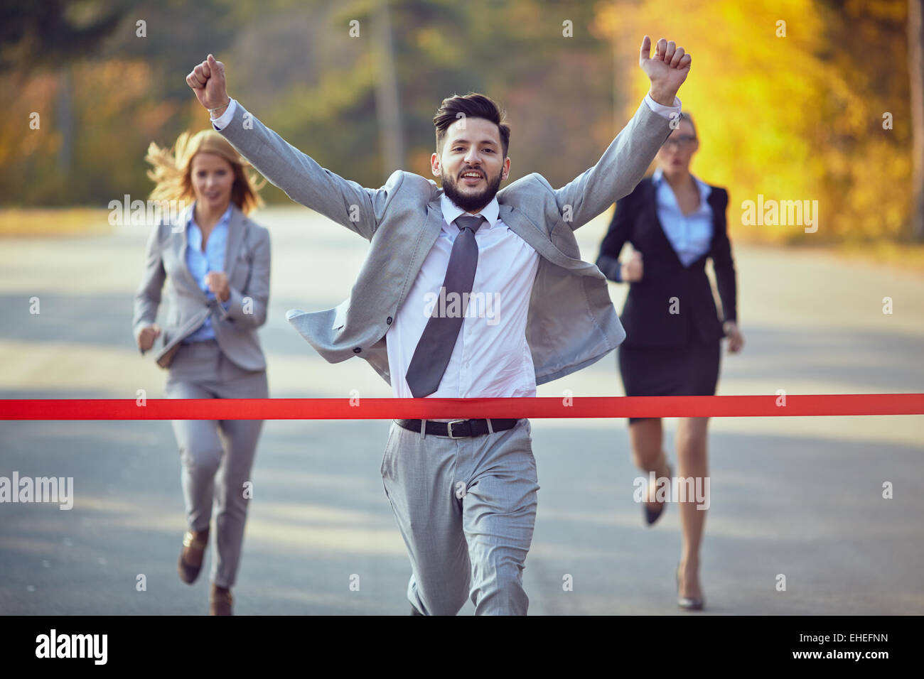 Businessman reaching finish line Stock Photo - Alamy
